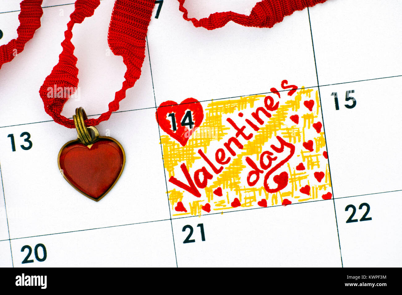 Reminder Valentine`s Day in calendar with red heart. Close-up Stock ...