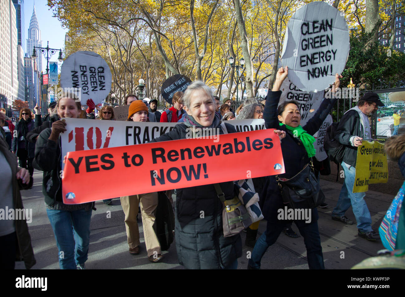 Environmental activists march in midtown Manhattan sending the message ...