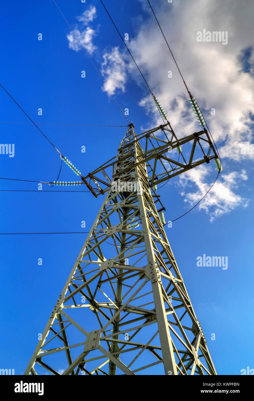 High voltage electrical overhead line on blue sky Stock Photo - Alamy