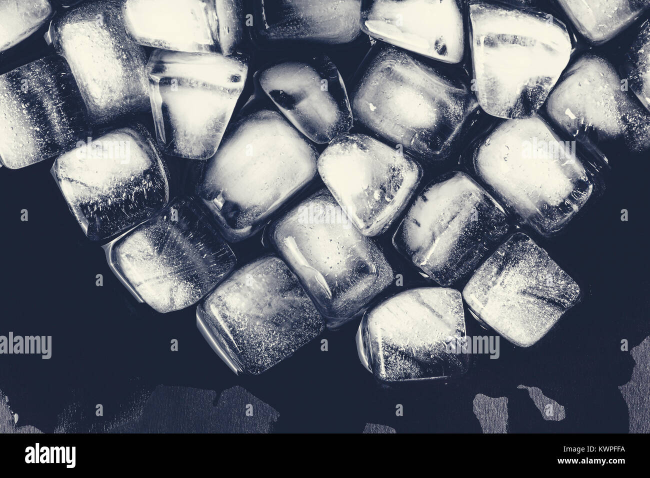 Texture of ice cubes on a dark background. Chaotic scattered icicles on ...