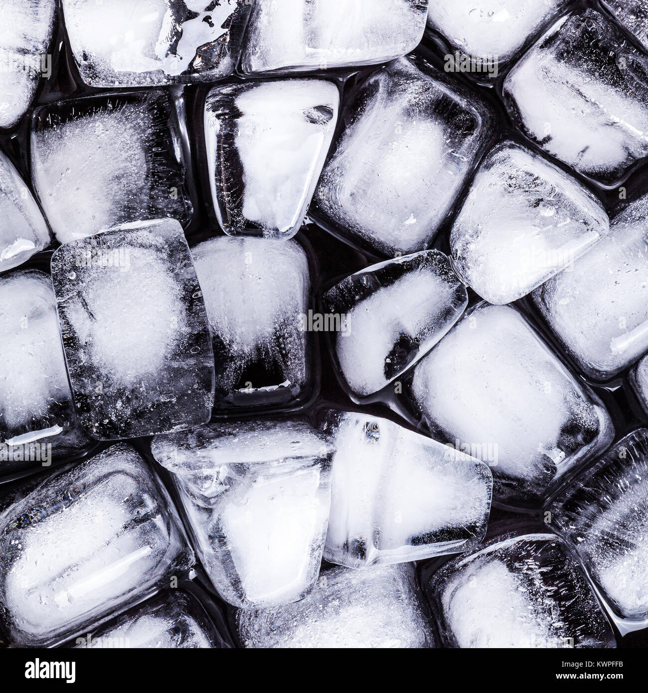 Texture of ice cubes on a dark background. Chaotic scattered icicles on ...