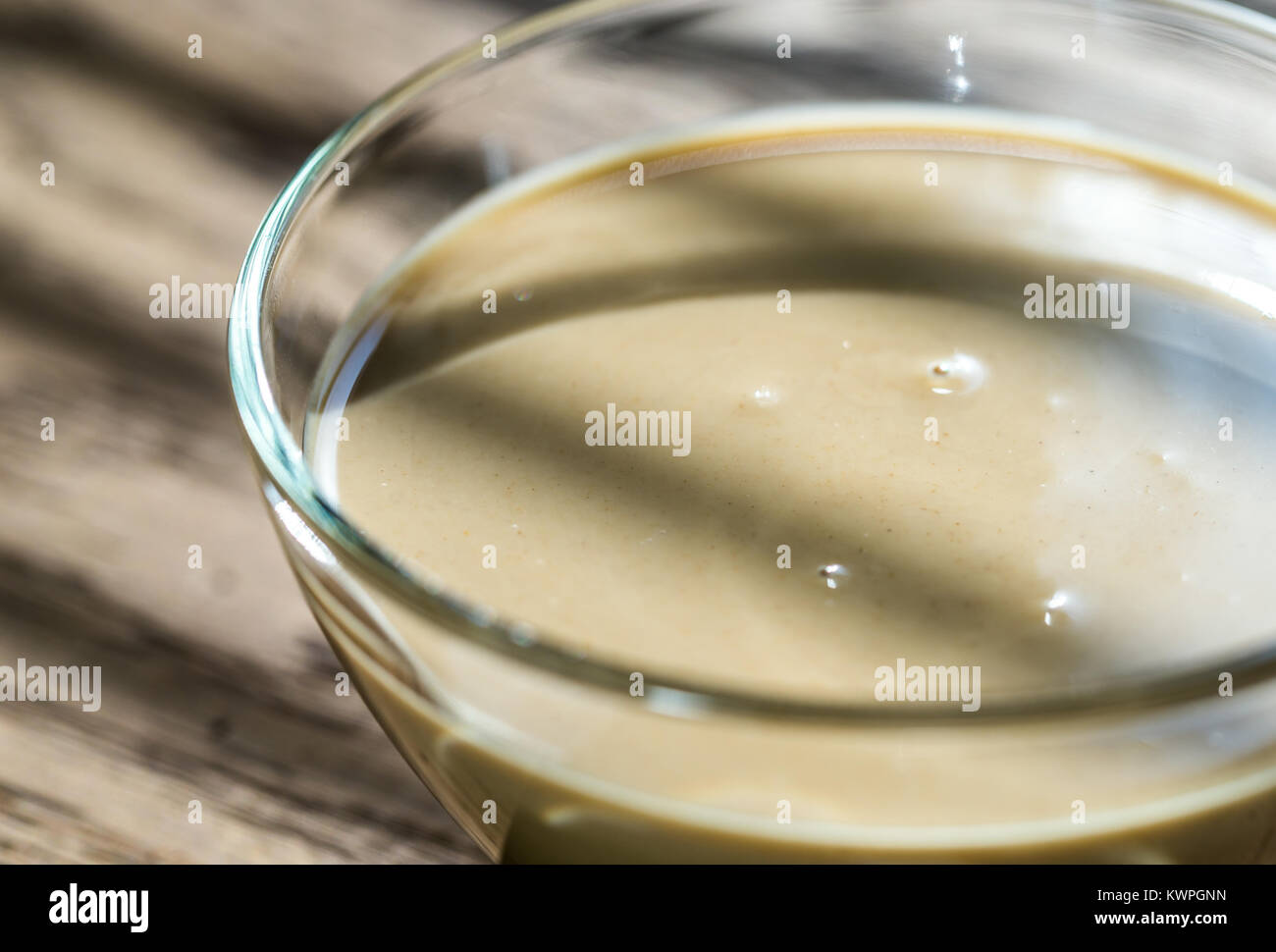 Bowl of tahini Stock Photo - Alamy