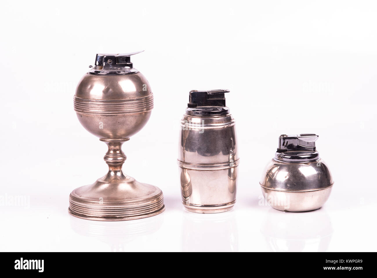 vintage silver lighter from interwar period over a white background ...