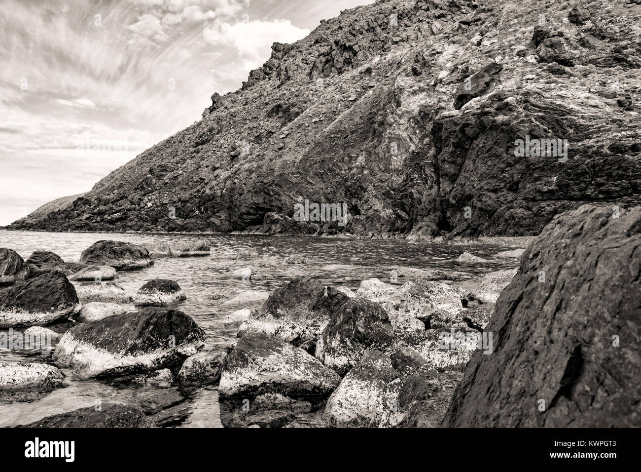 Wild rock beach with natural rock formation. It is located near the ...