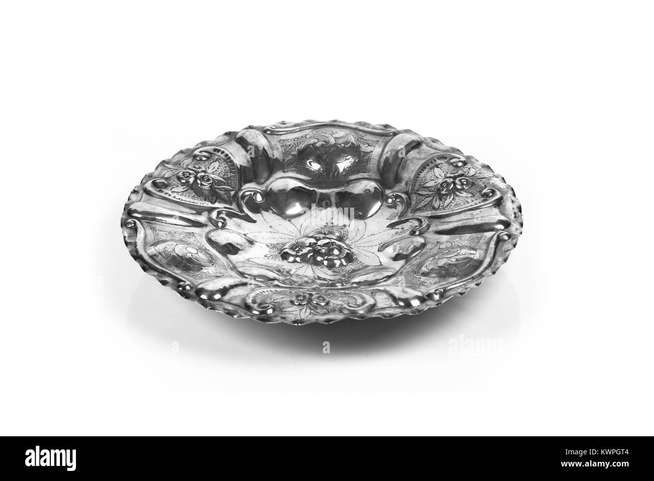 handcrafted antique silver plate decorative over a white background ...