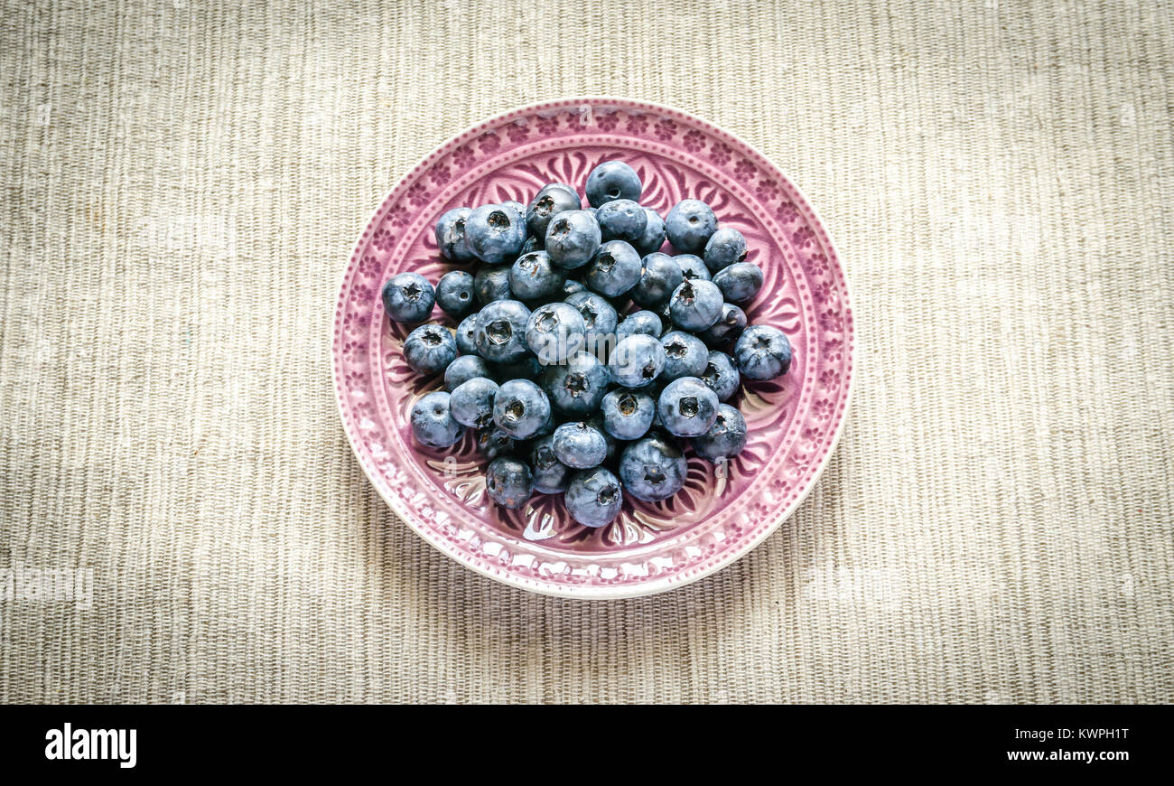 Fresh blueberries on the decorated plate Stock Photo - Alamy