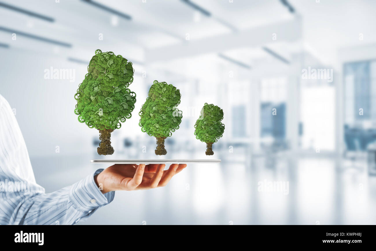 Eco green environment concept presented by tree as working mechanism or ...