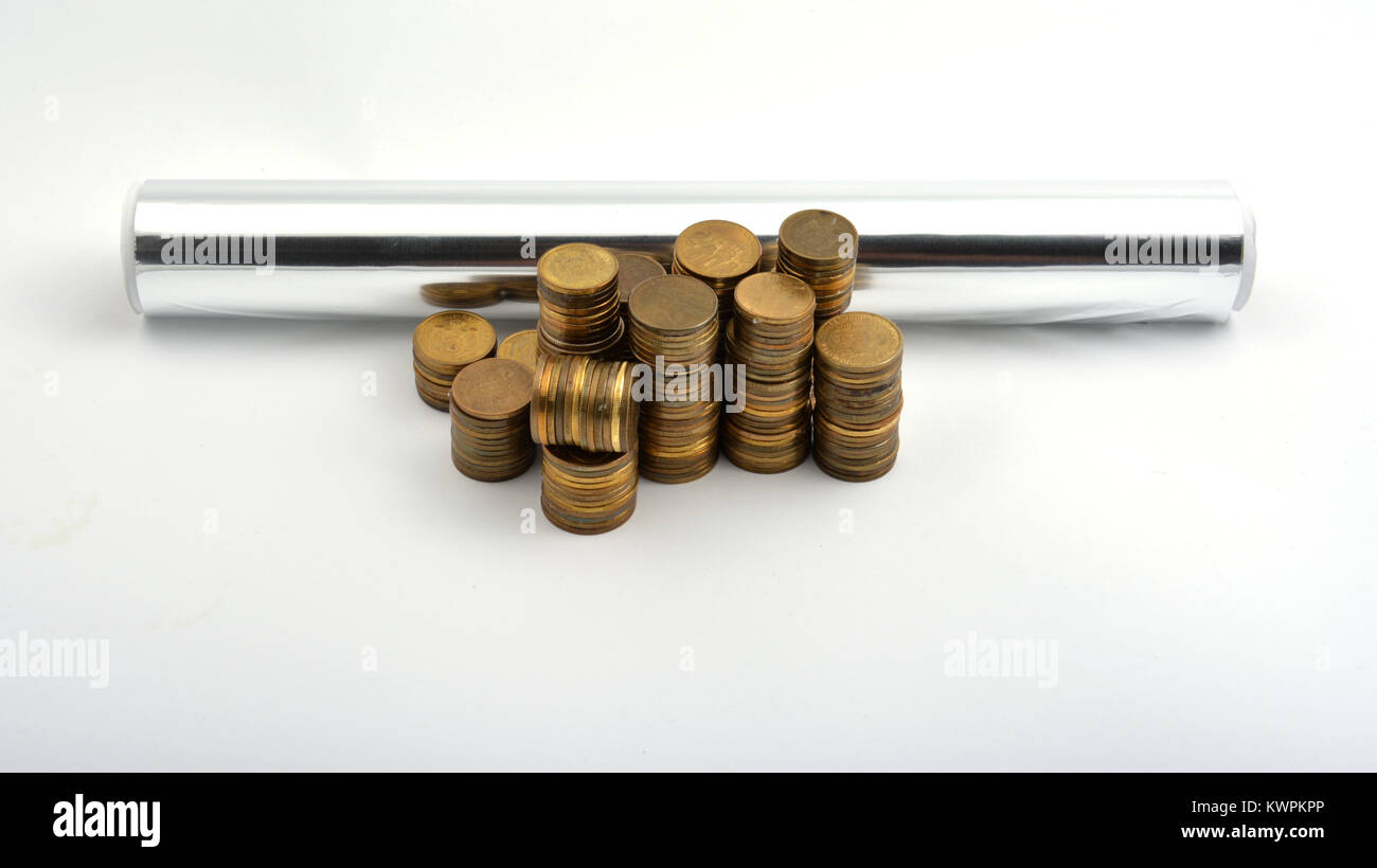 Aluminium foil with coins isolated on white background Stock Photo - Alamy