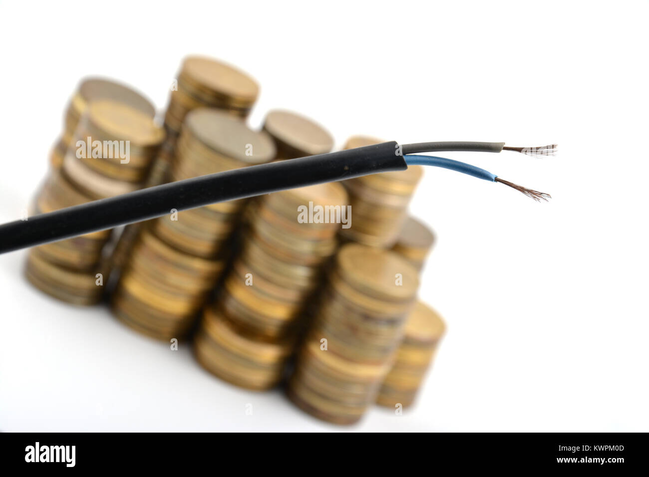 Electric cable with coins isolated on white background Stock Photo - Alamy