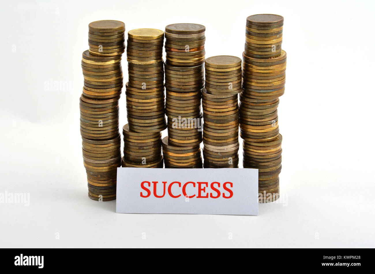 Word success with coins isolated on white background Stock Photo - Alamy