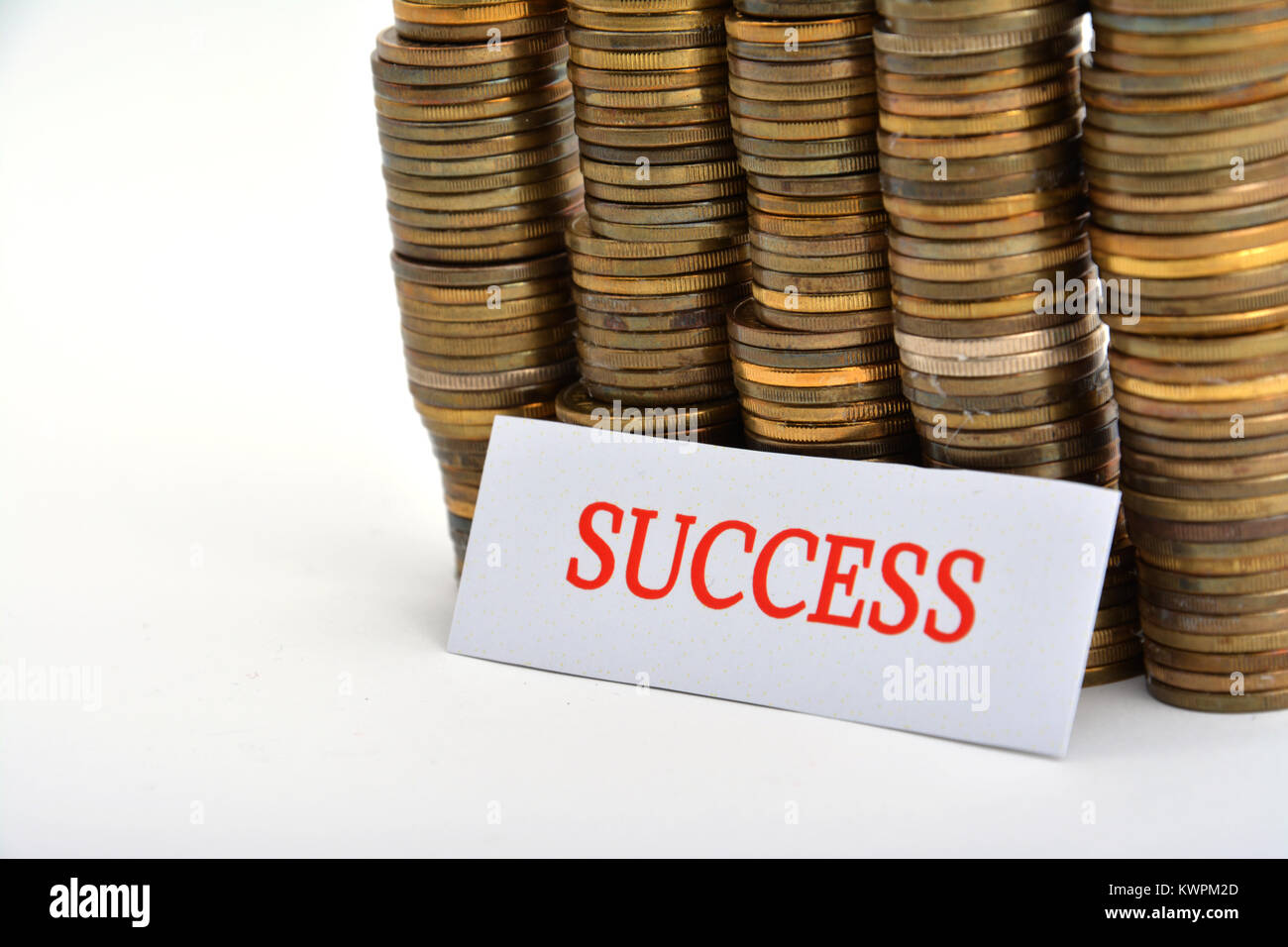 Word success with coins isolated on white background Stock Photo - Alamy