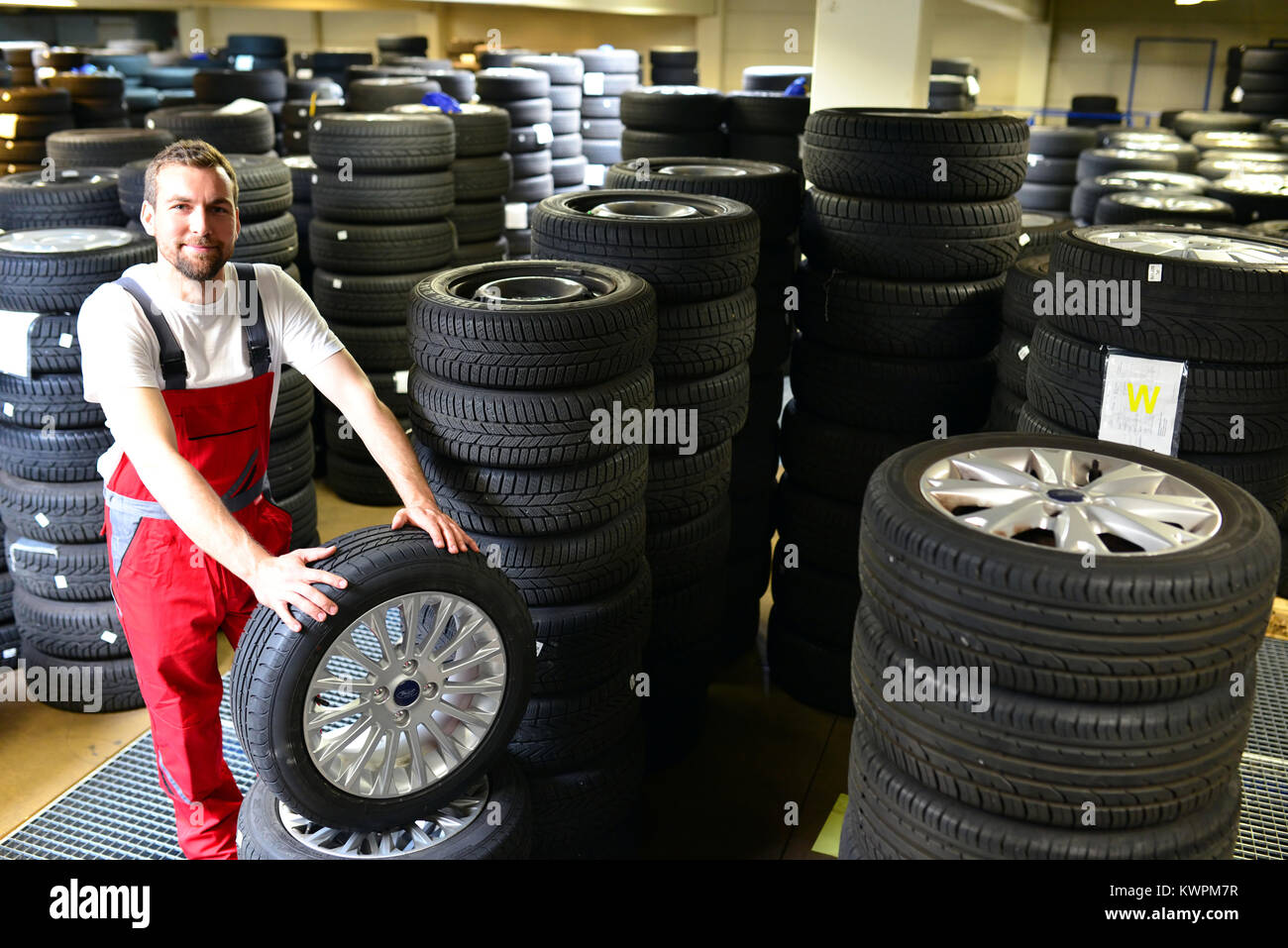 department store with car tyres in a garage - tyre change Stock Photo ...