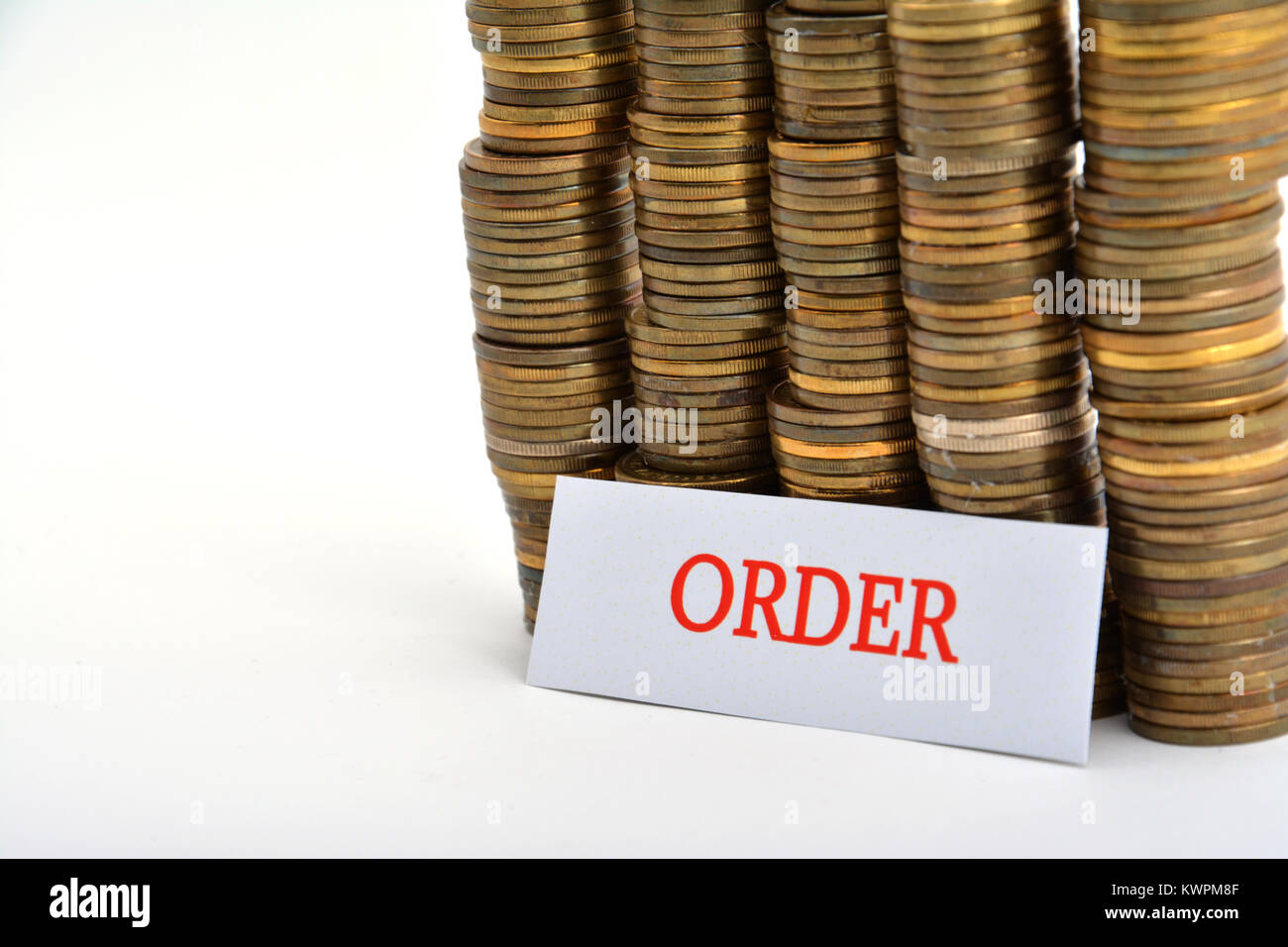 Word order with coins isolated on white background Stock Photo - Alamy