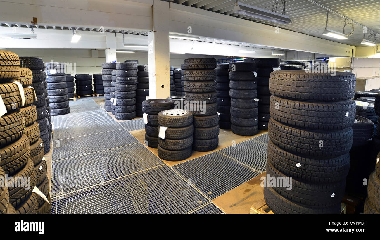 department store with car tyres in a garage - tyre change Stock Photo ...