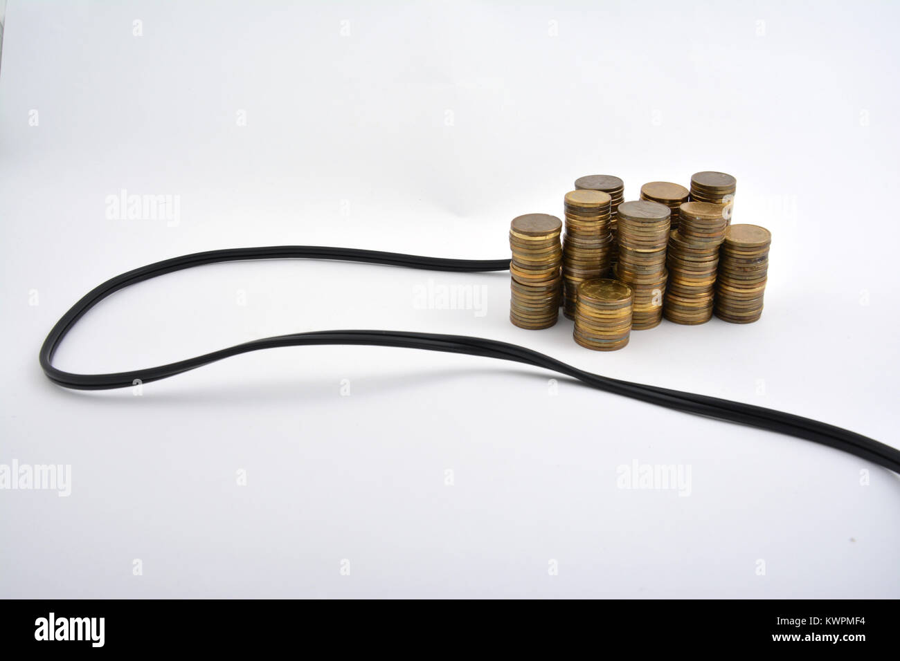 Electric cable with coins isolated on white background Stock Photo - Alamy