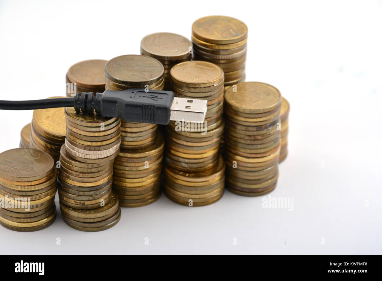 USB cable with coins isolated on white background Stock Photo - Alamy