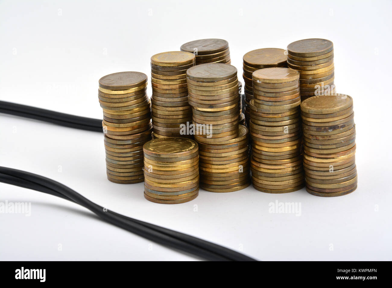 Electric cable with coins isolated on white background Stock Photo - Alamy
