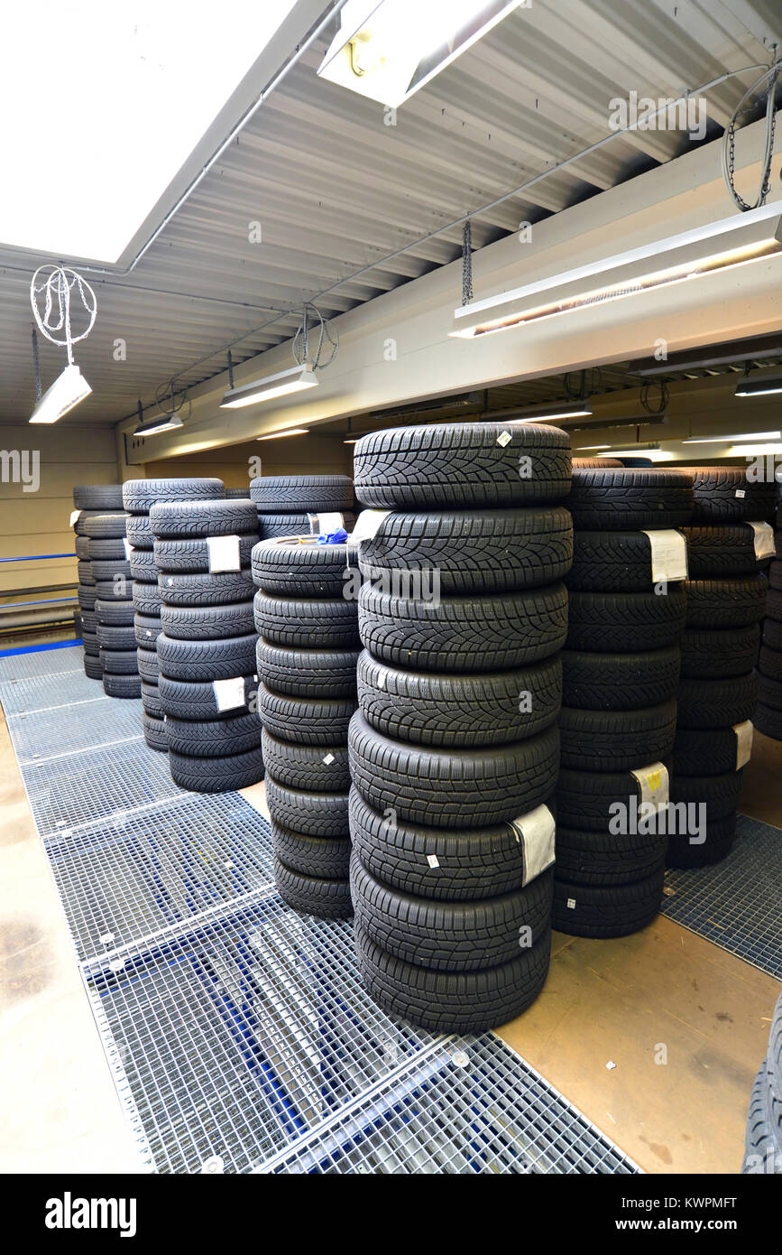 department store with car tyres in a garage - tyre change Stock Photo ...