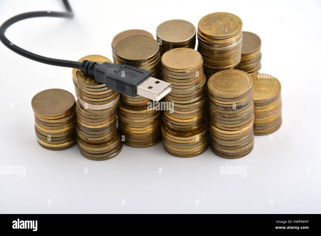 USB cable with coins isolated on white background Stock Photo - Alamy