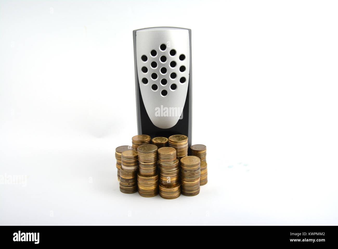 Speakers with coins isolated on white background Stock Photo - Alamy