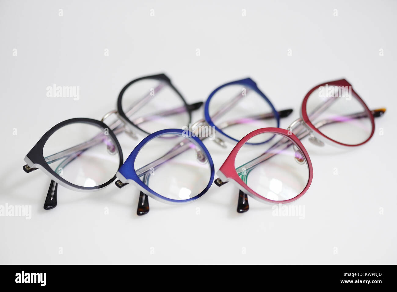Multicolored glasses on the white background Stock Photo - Alamy