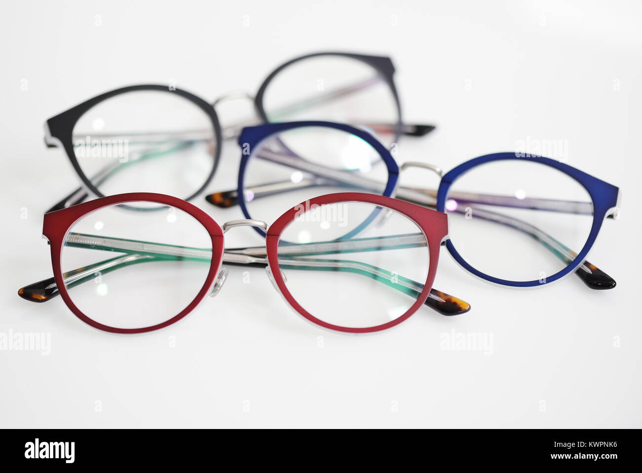 Multicolored glasses on the white background Stock Photo - Alamy