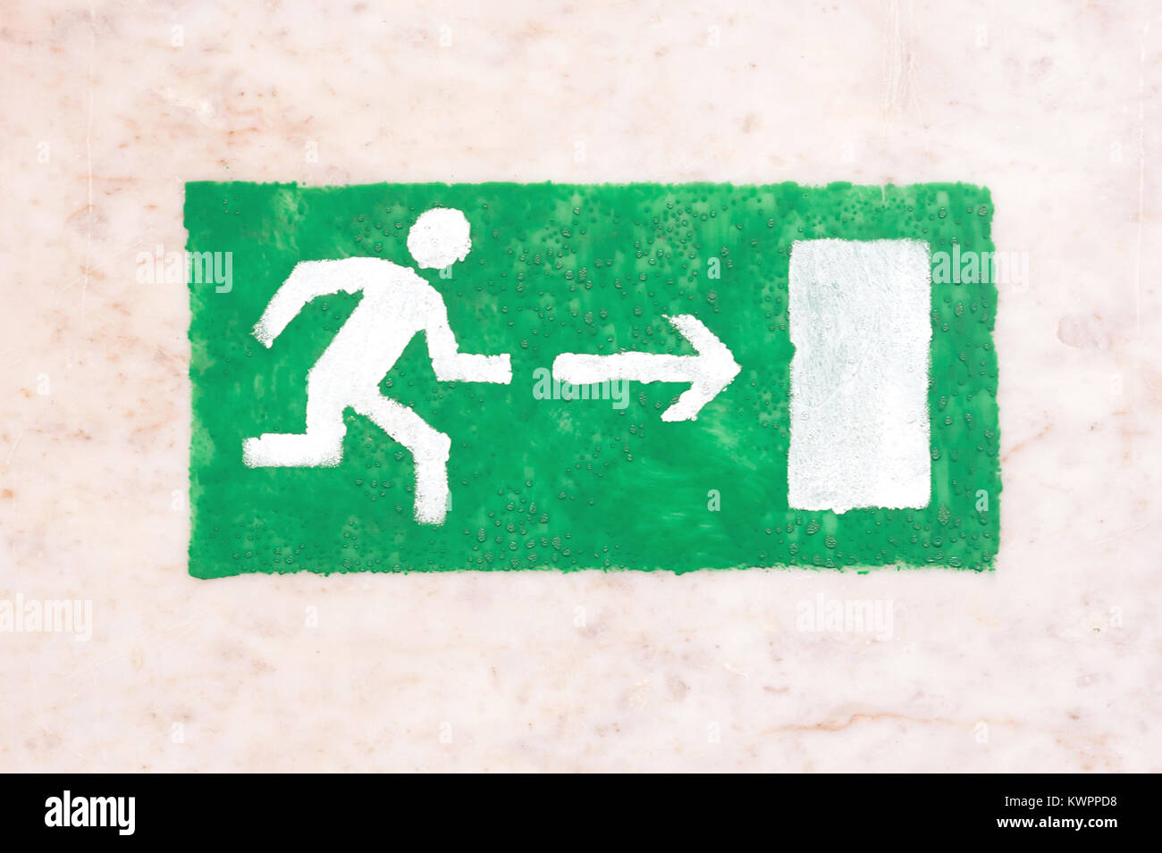 Emergency exit sign, green on a light background, visitor safety, the ...