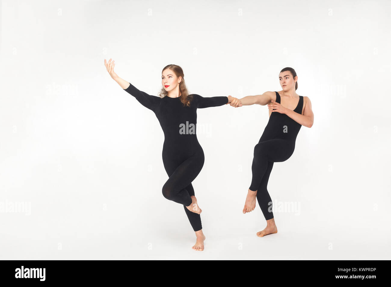 Harmony, partnership. Friends holding hands and dancing. Studio shot ...