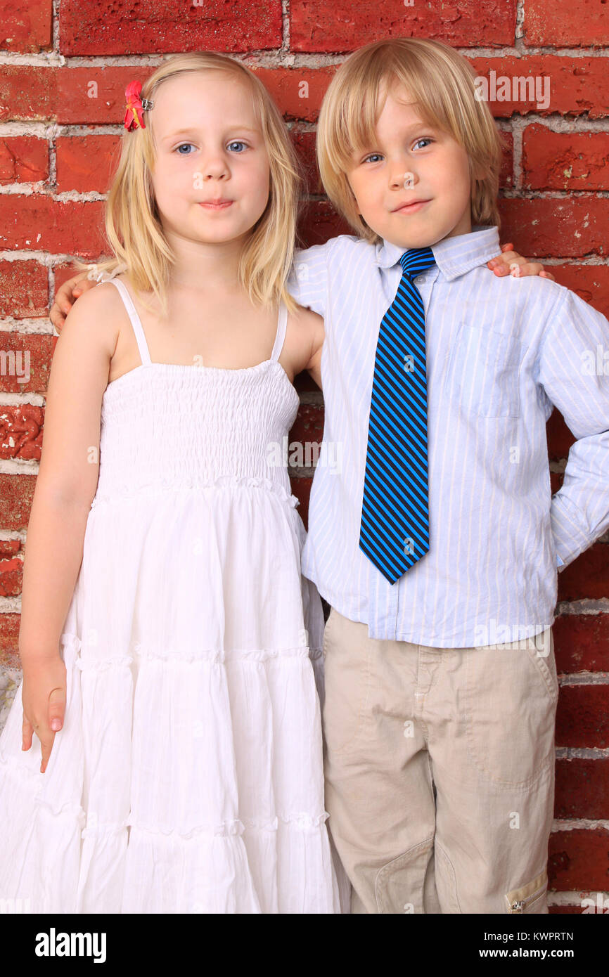 Happy children hugging and smiling Stock Photo - Alamy