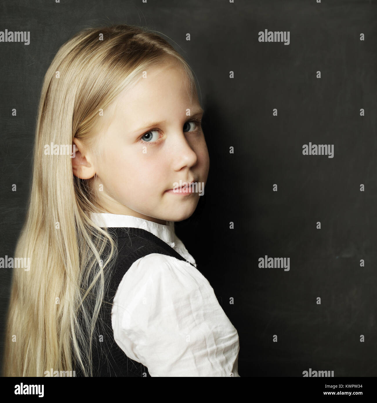 Pupil with school blackboard, face closeup Stock Photo - Alamy