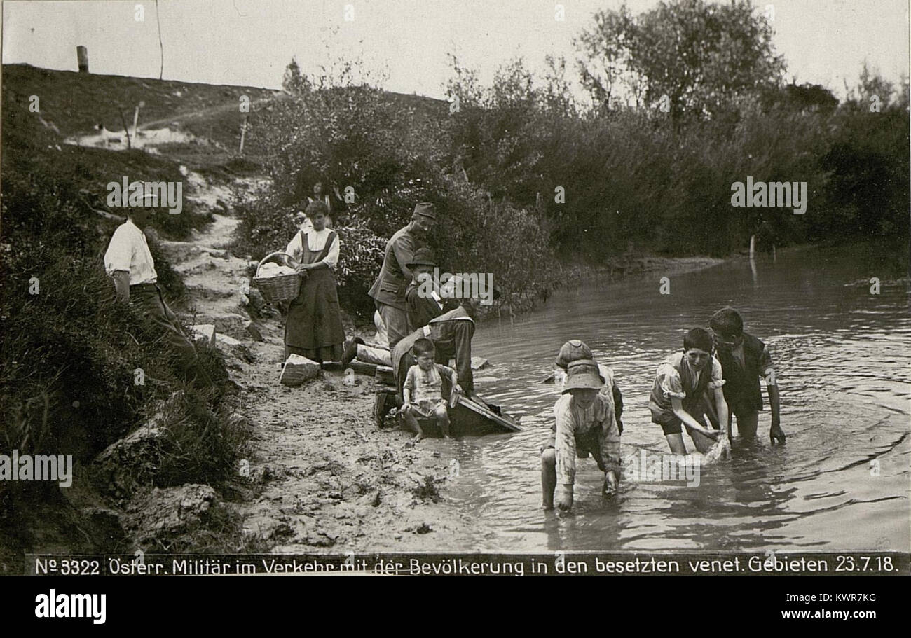 A 1918 World War I image showing military personnel and civilians in ...