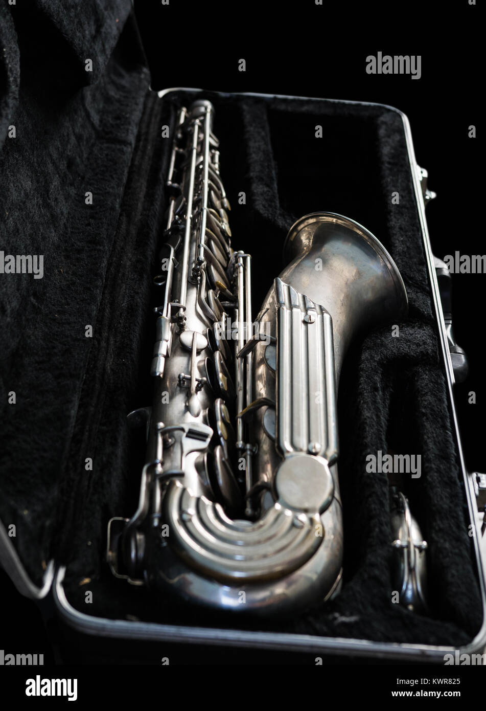 Silver saxophone in its case Stock Photo - Alamy