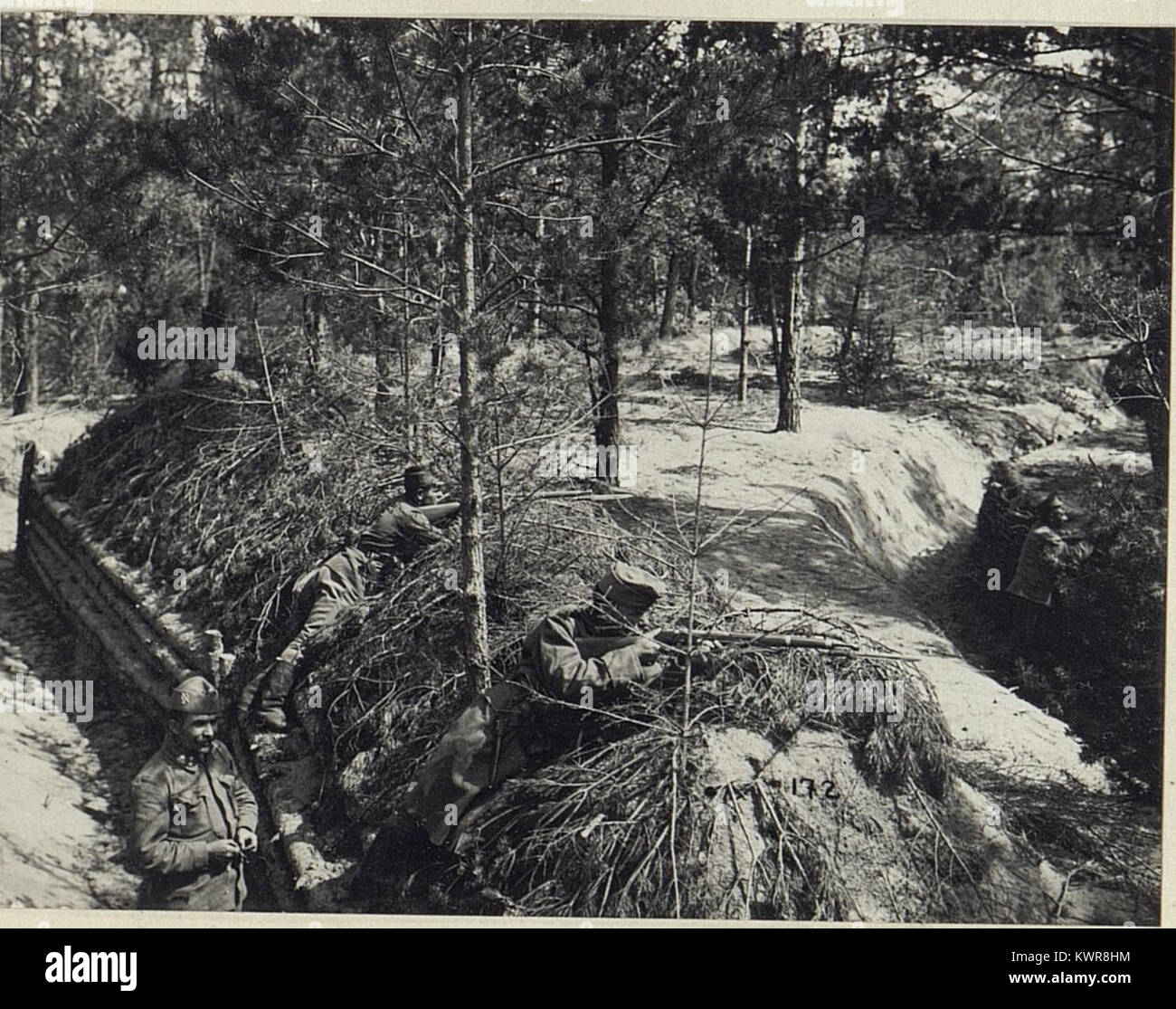 Black-and-white image of a trench line and fortified earthworks manned ...