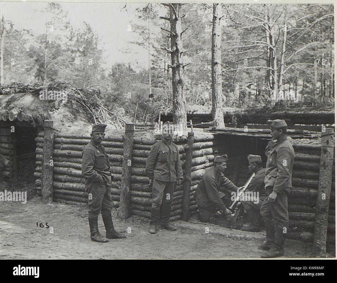 This photograph depicts a World War I German Minenwerfer (trench mortar ...