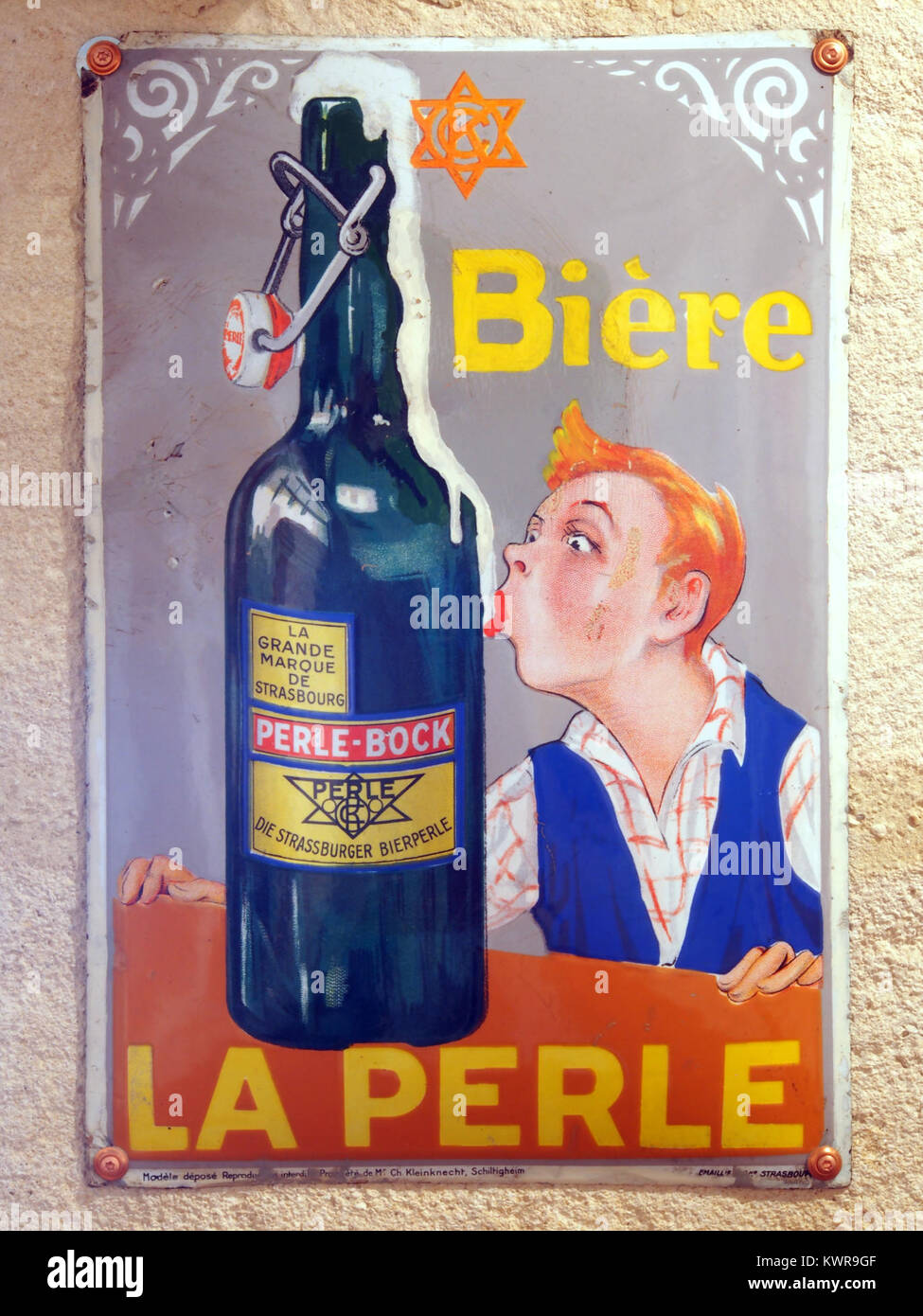This enamel advertising sign for Bière La Perle is displayed at the ...