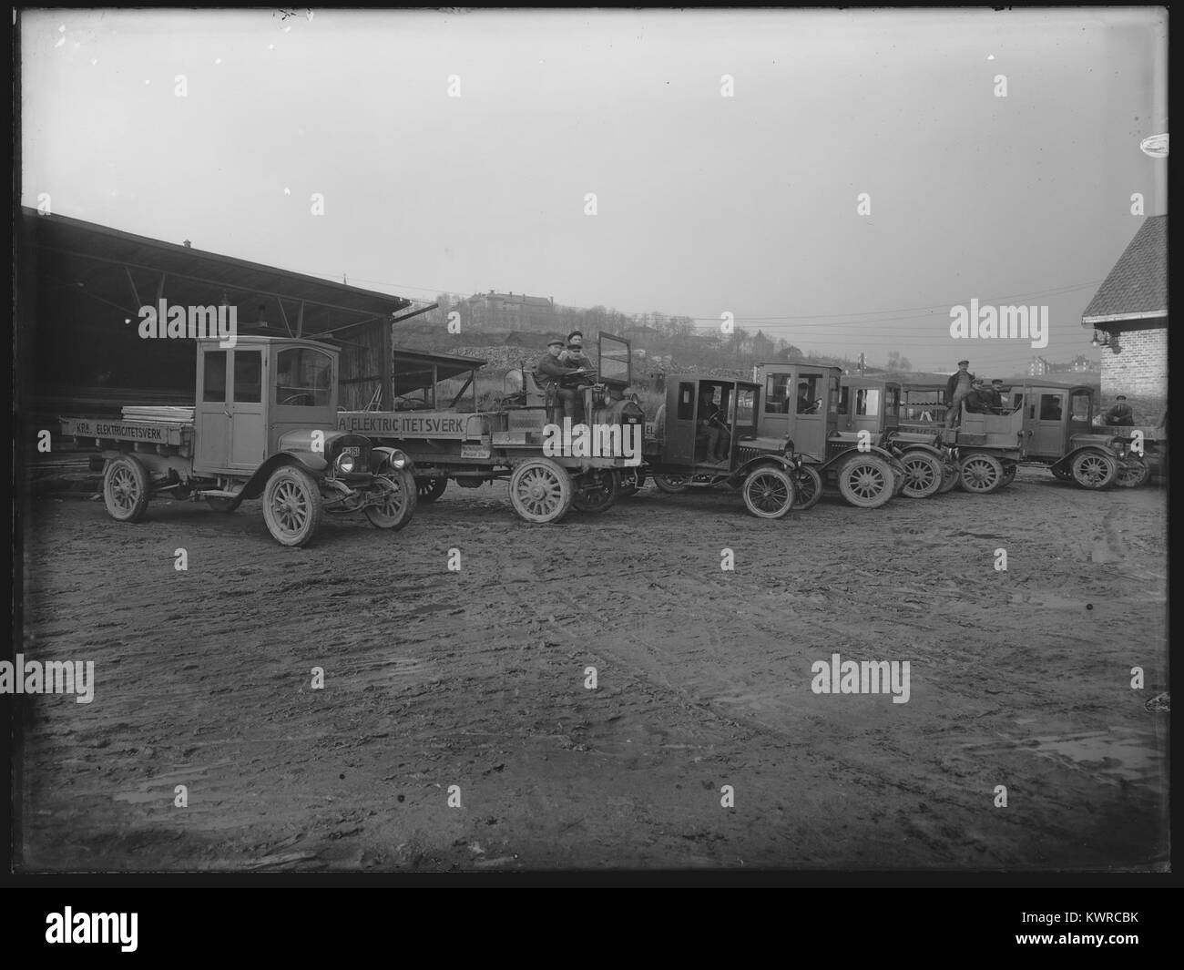 This archival photograph titled ''Øgaard Spedoill'' shows a street ...