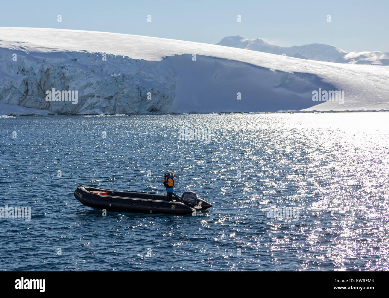 Large inflatable Zodiac boats shuttle alpine mountaineering skiers to ...