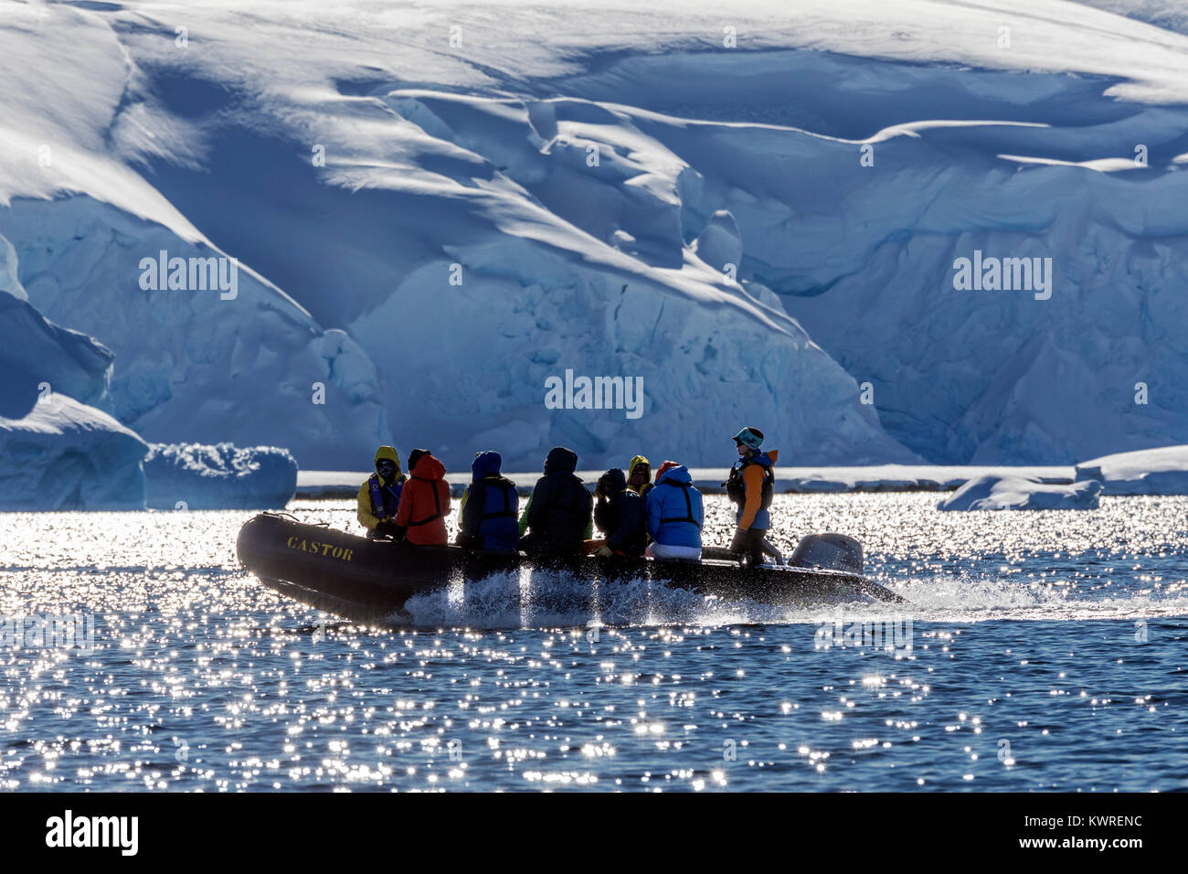 Large inflatable Zodiac boats shuttle alpine mountaineering skiers to ...
