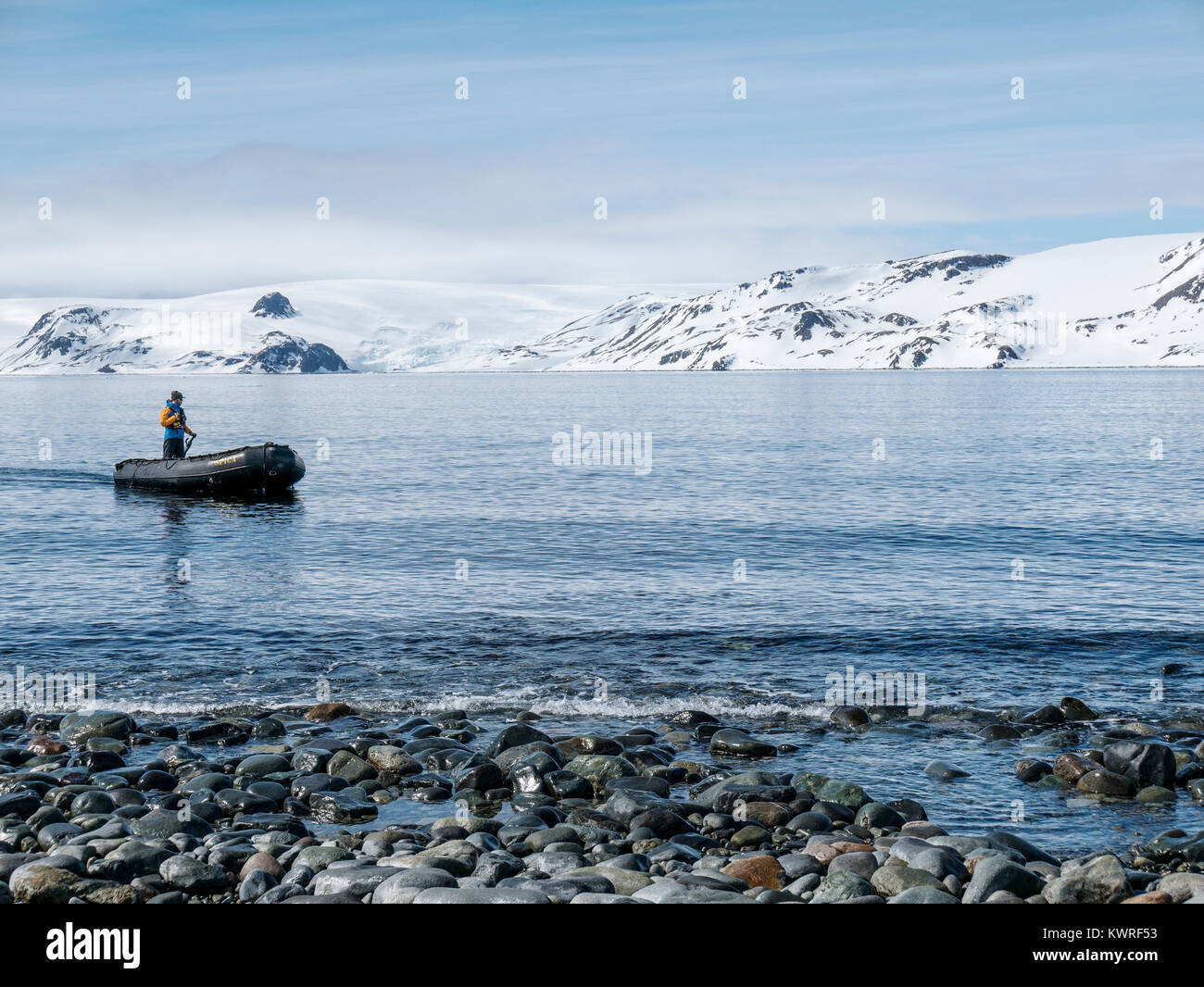 Large inflatable Zodiac boats shuttle alpine mountaineering skiers to ...