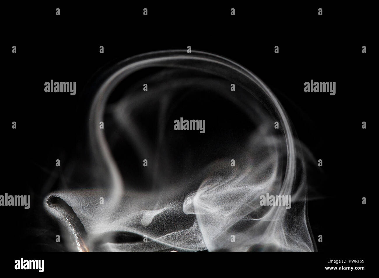 Circular shaped smoke trail from a wick Stock Photo - Alamy