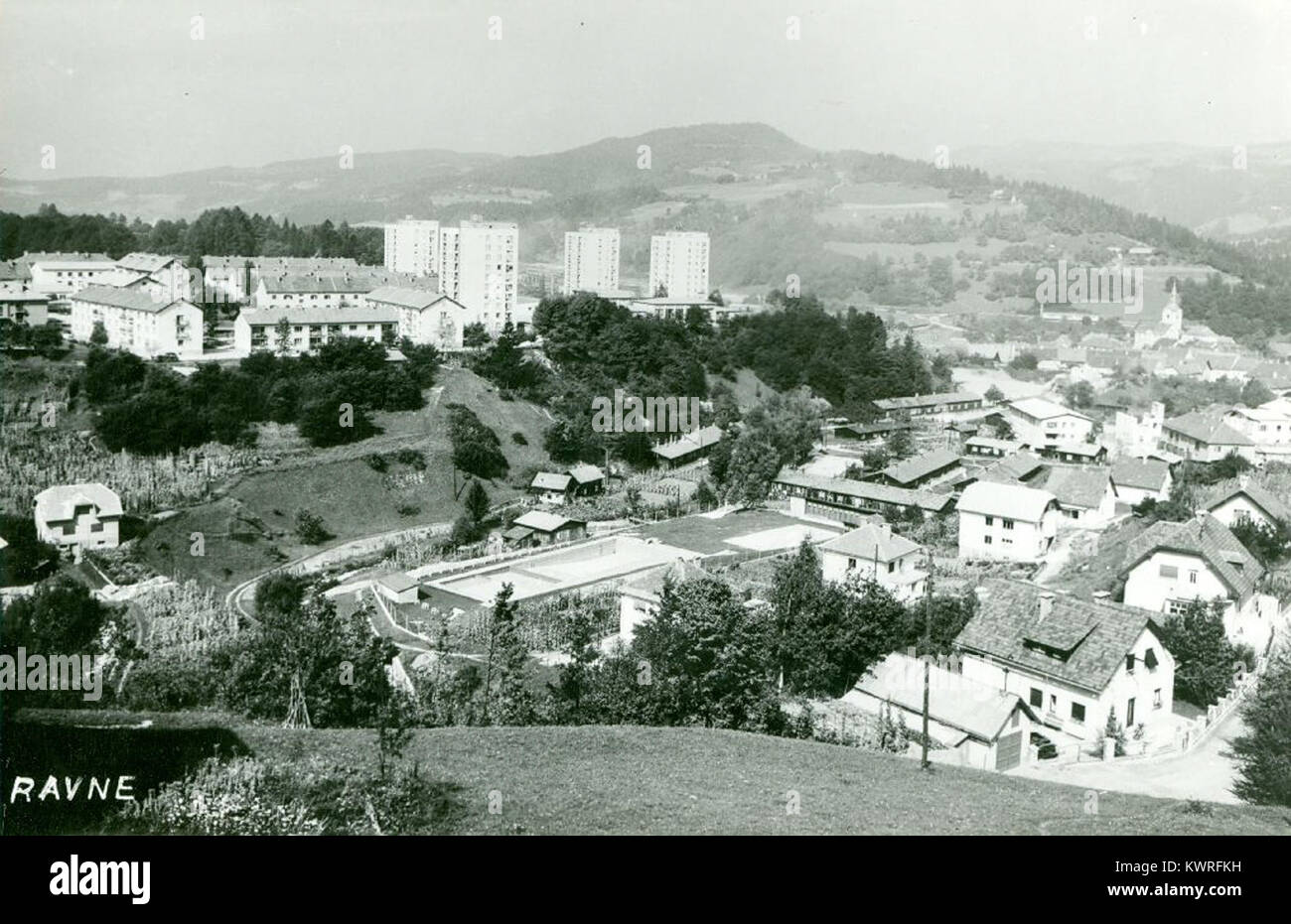 This 1960 postcard shows a view of Raven na Koroškem, a town in ...