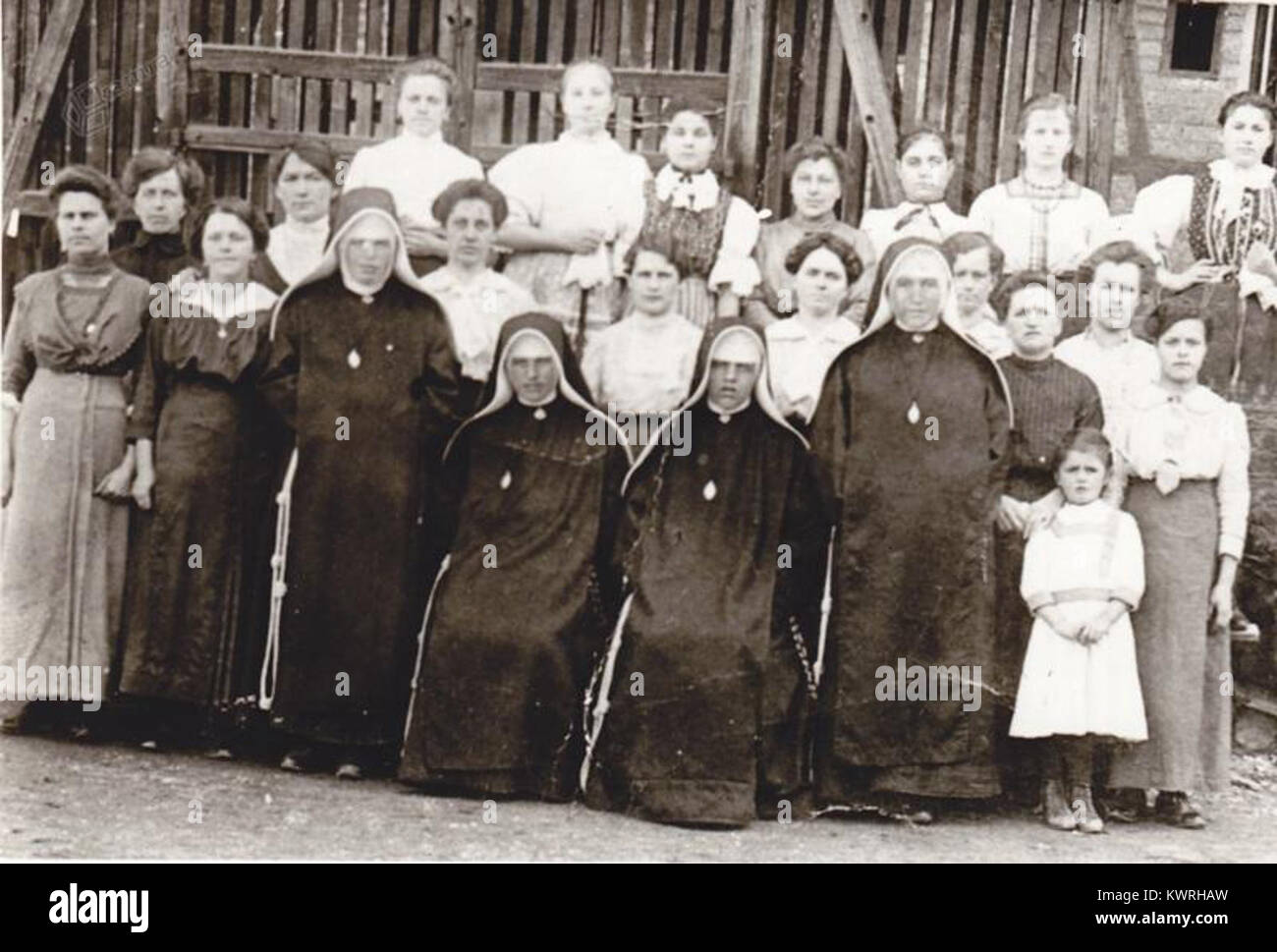 A photograph from 1918 showing nuns and young women from Mädchenheim, a ...