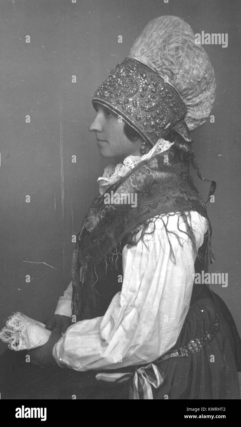 A reconstruction of a mid-19th-century woman's attire, showcasing ...