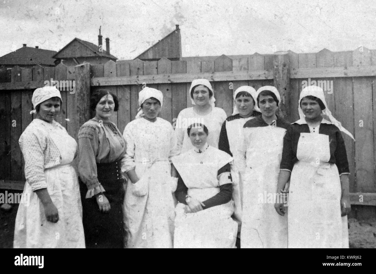 This image depicts nurses standing outside a field barrack-hospital ...