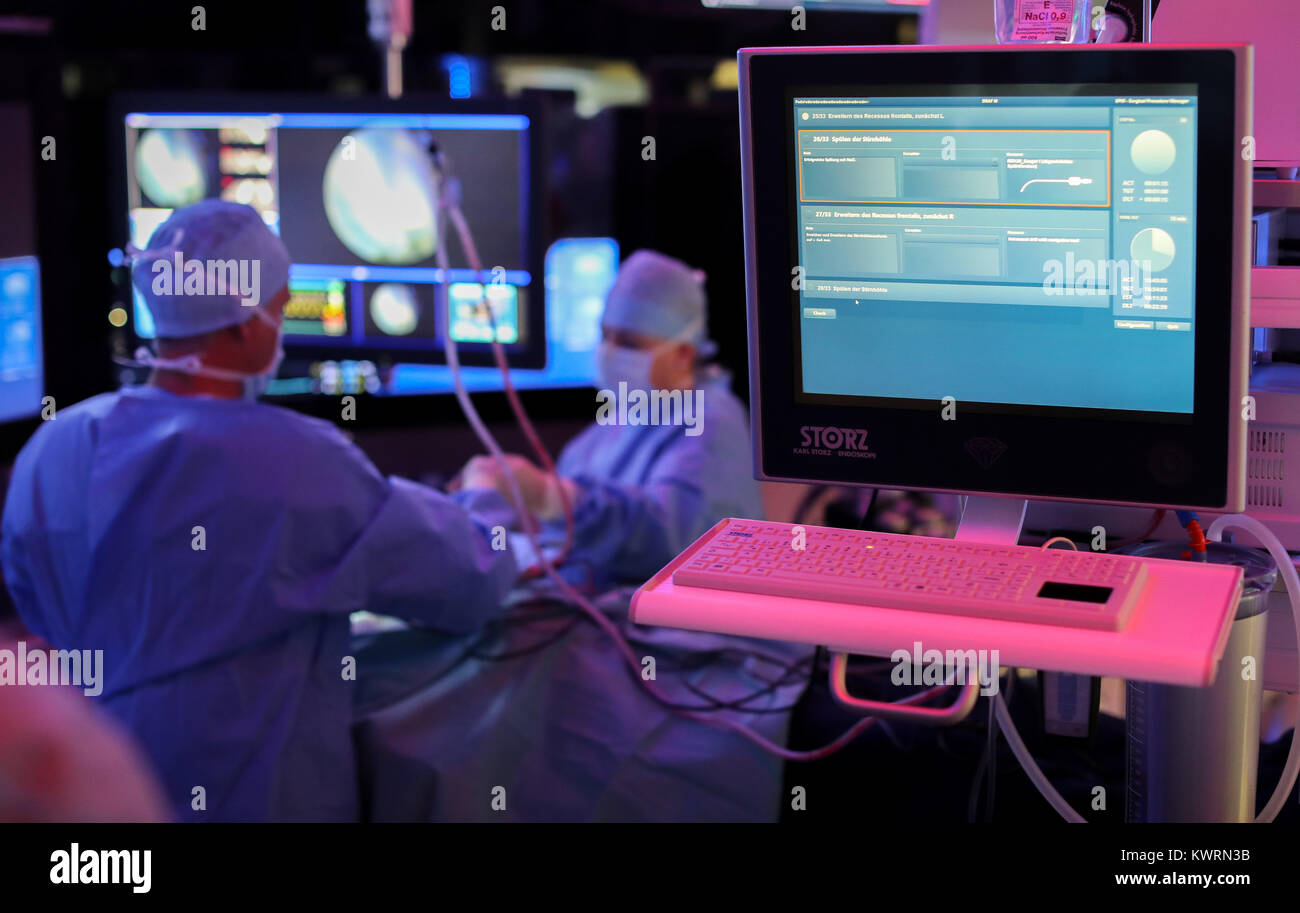 Professor Gero Strauss (L) performs a paranasal sinus surgery with the ...