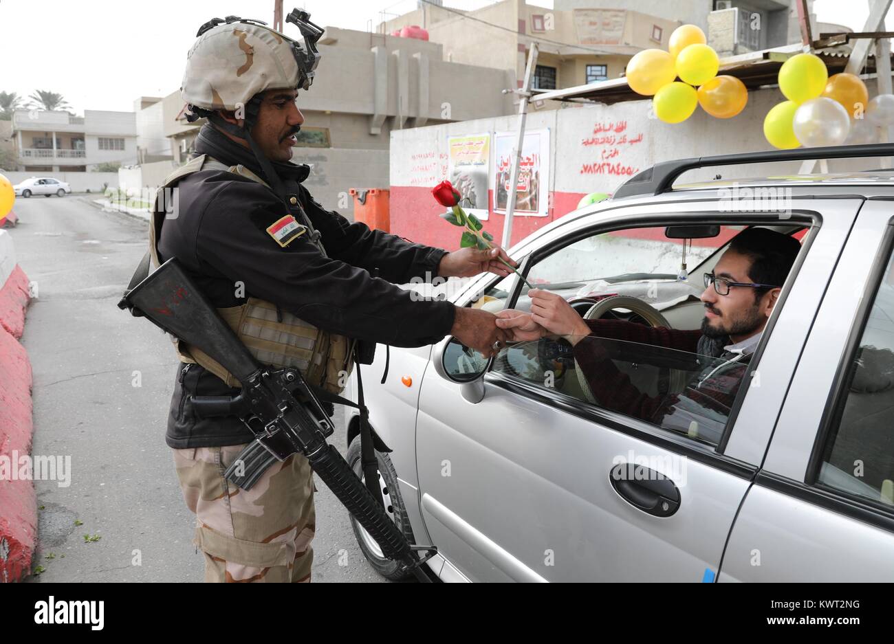 Baghdad. 6th Jan, 1921. An Iraqi soldier receives a flower from a man ...
