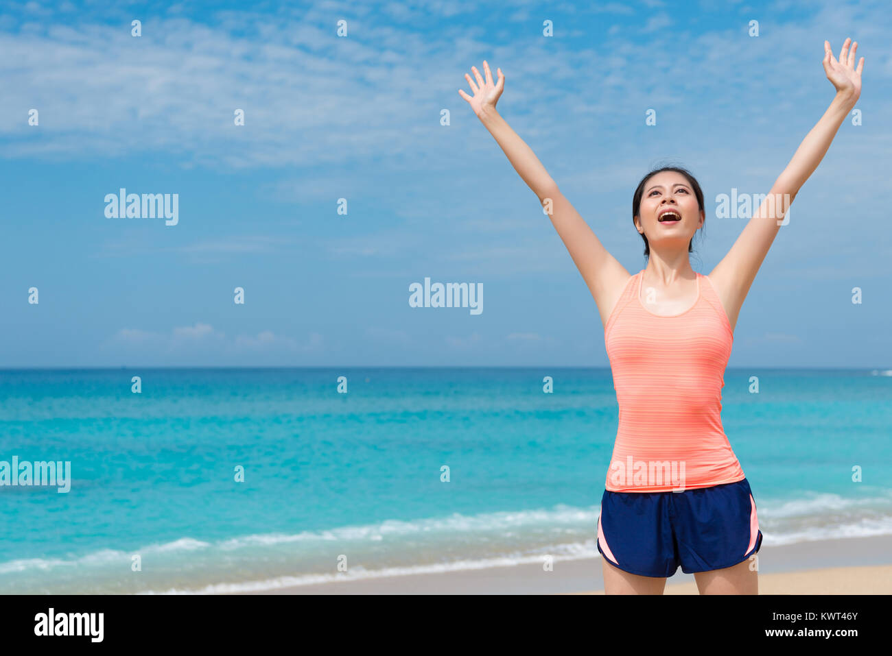Female happy jogging beach hi-res stock photography and images - Alamy