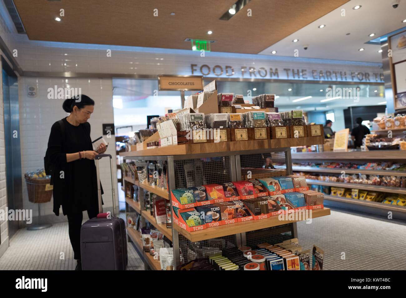 A woman browses through artisan chocolates at Napa Farms Market, a ...