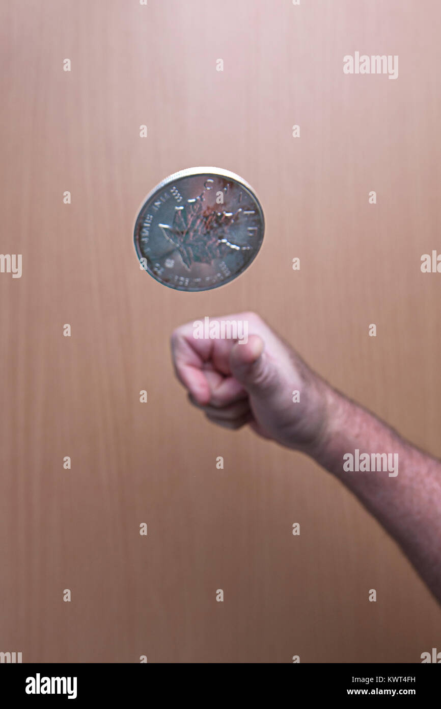 Spinning coin hi-res stock photography and images - Alamy