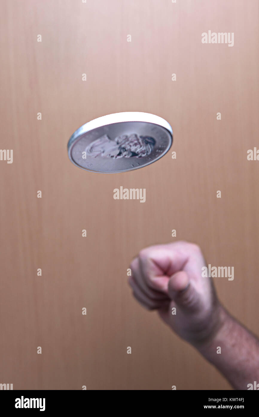 Flipping coin canadian hi-res stock photography and images - Alamy